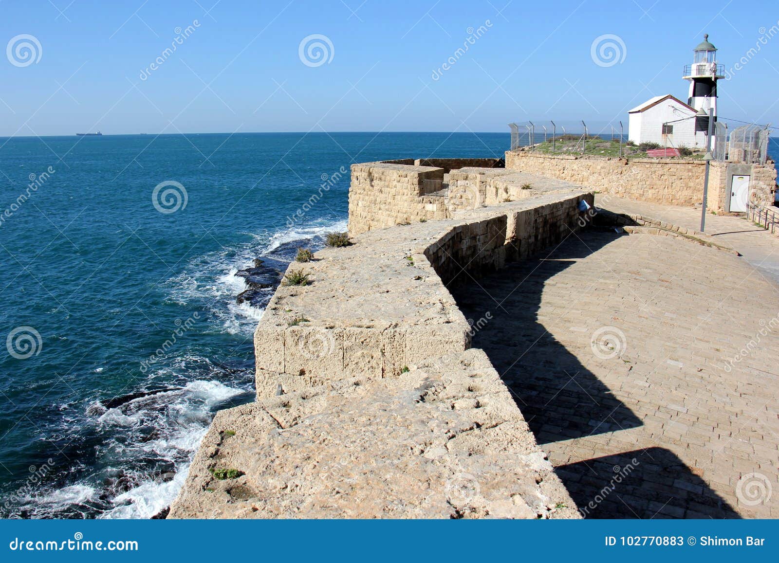 Lighthouse on the beach stock image. Image of harbor - 102770883