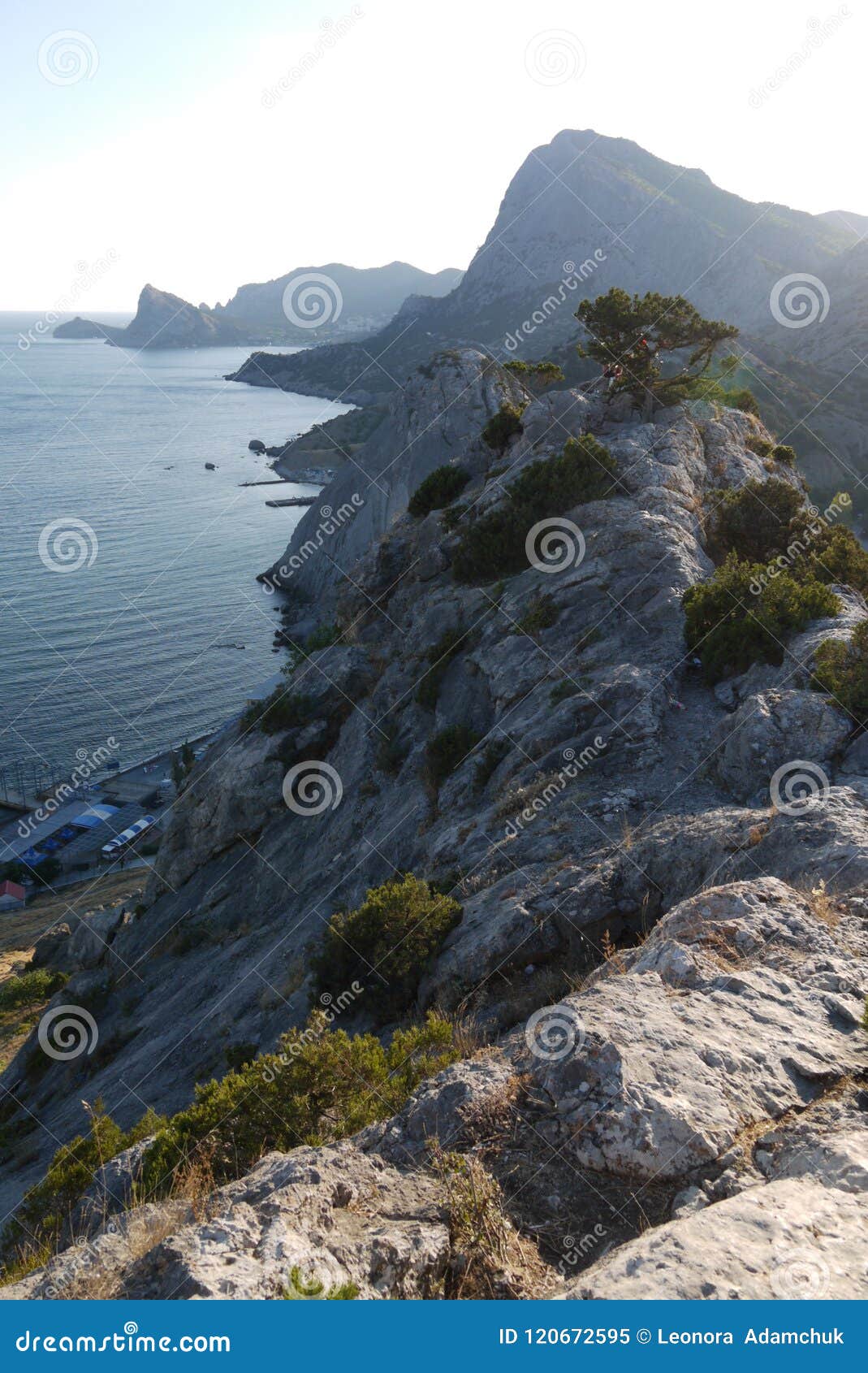 Coastal Steep Cliffs on the Background of High Mountains Covered Stock ...