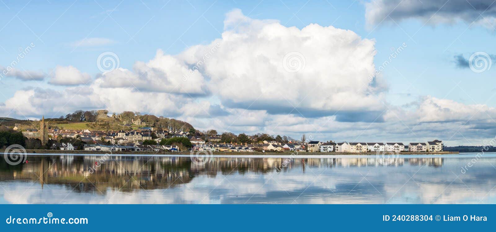 Coastal Town Reflected in a Calm Sea Stock Photo - Image of calm ...