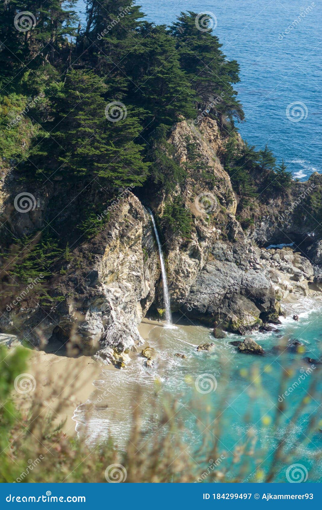 Coastal Waterfall Cascading Onto Pacific White Sand Beach Surrounded by ...