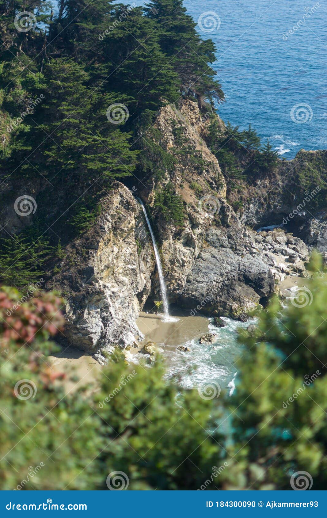 Coastal Waterfall Cascading Onto Pacific White Sand Beach Surrounded by ...