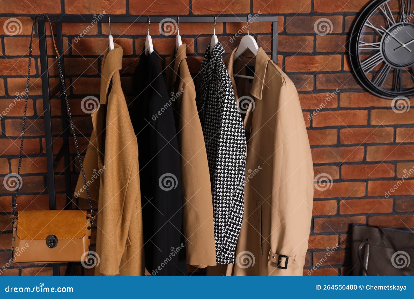 Coat Rack with Clothes Near Brick Wall in Hallway. Interior Design ...