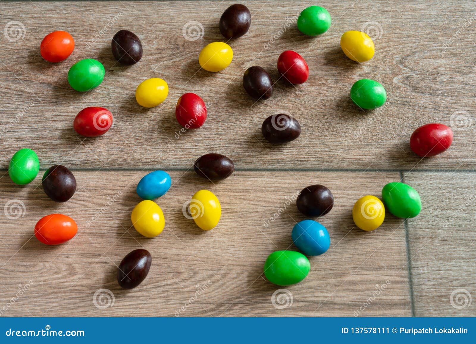 Coated Chocolate is Arrayed on Wooden Floor Stock Image - Image of ...
