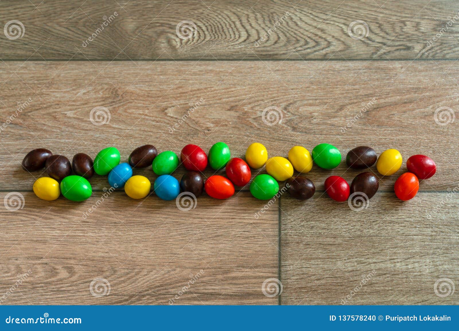 Coated Chocolate is Arrayed on Wooden Floor Stock Photo - Image of ...