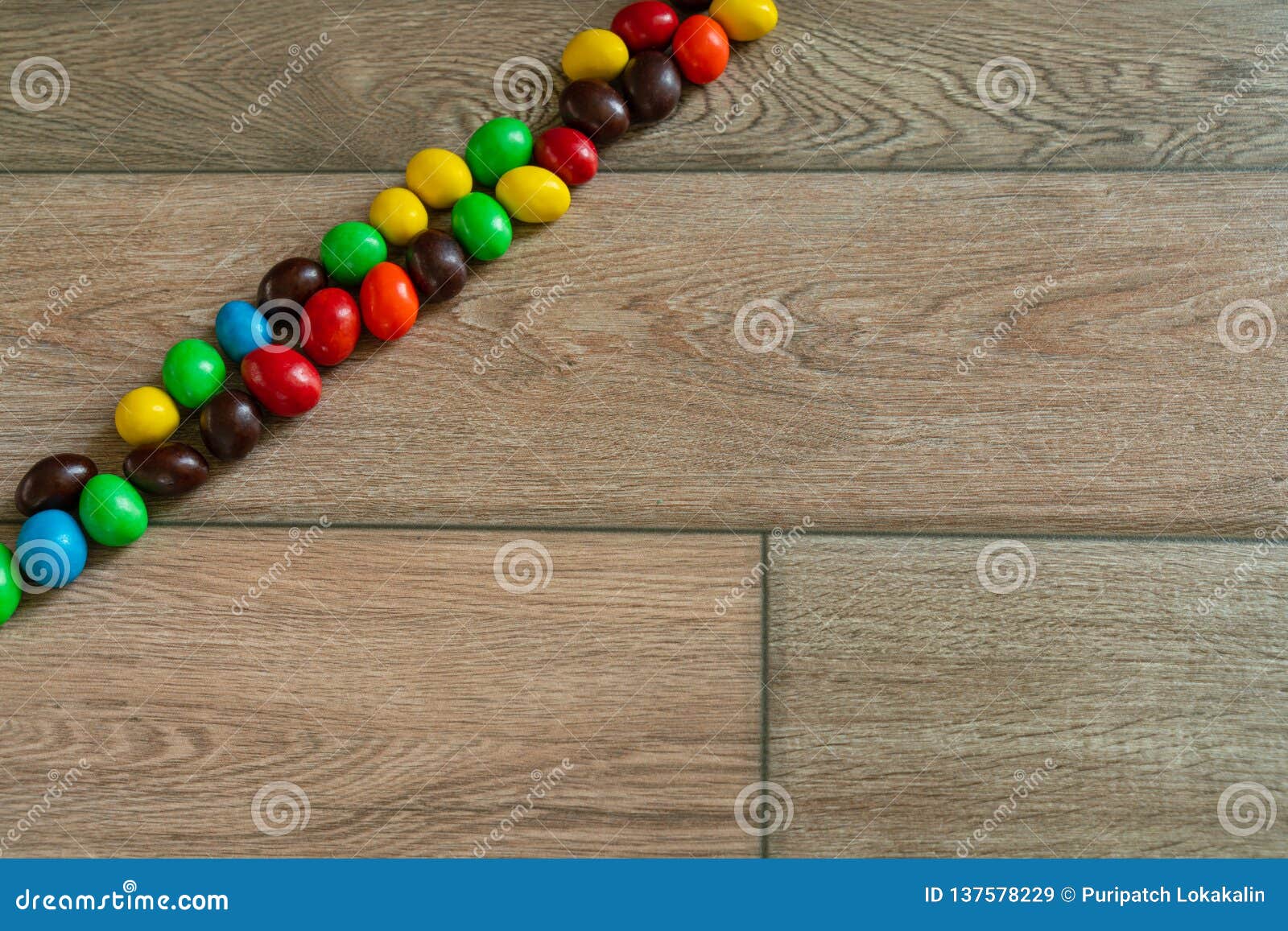 Coated Chocolate is Arrayed on Wooden Floor Stock Image - Image of ...