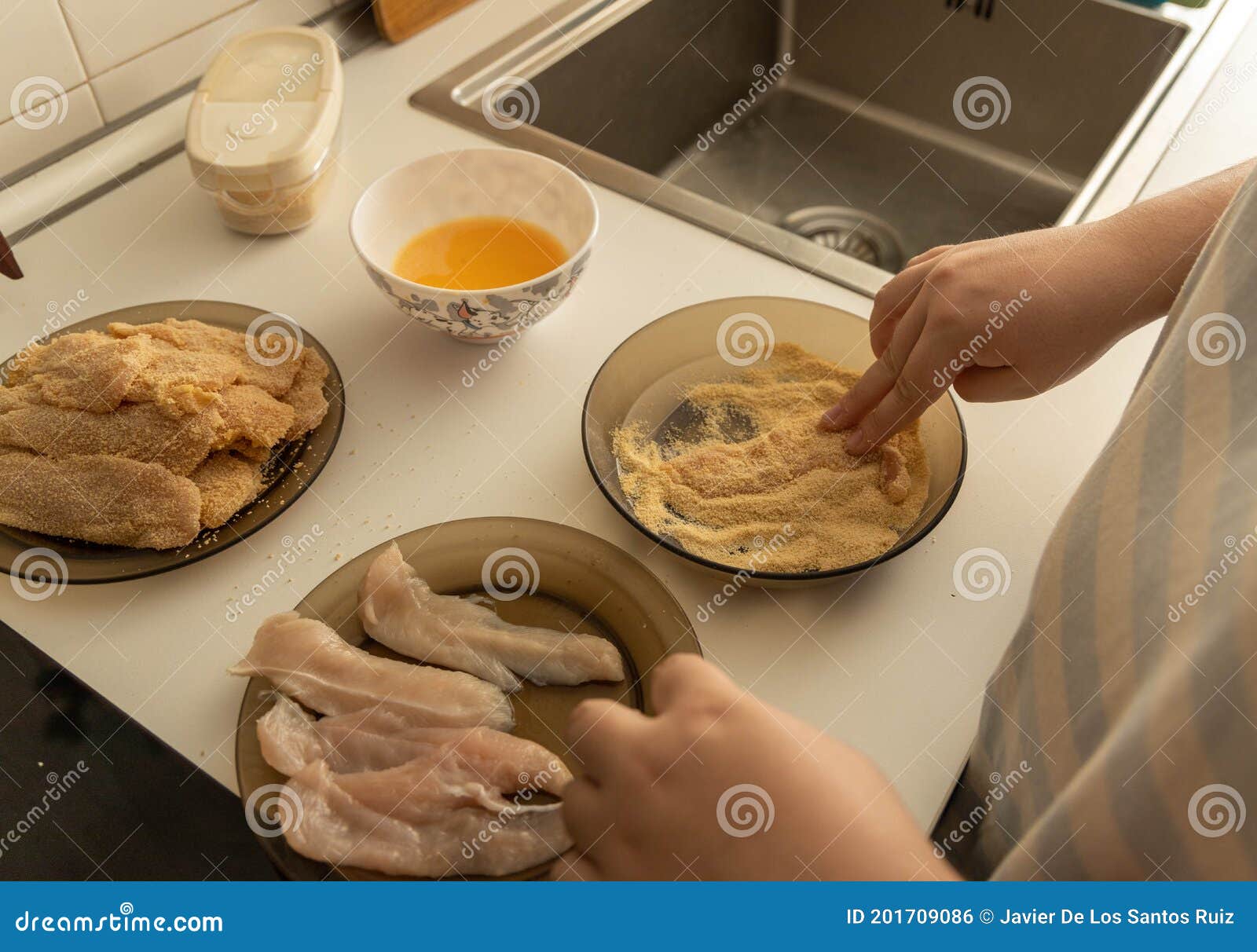 Woman Coating Chicken in the Kitchen Stock Photo - Image of chicken ...