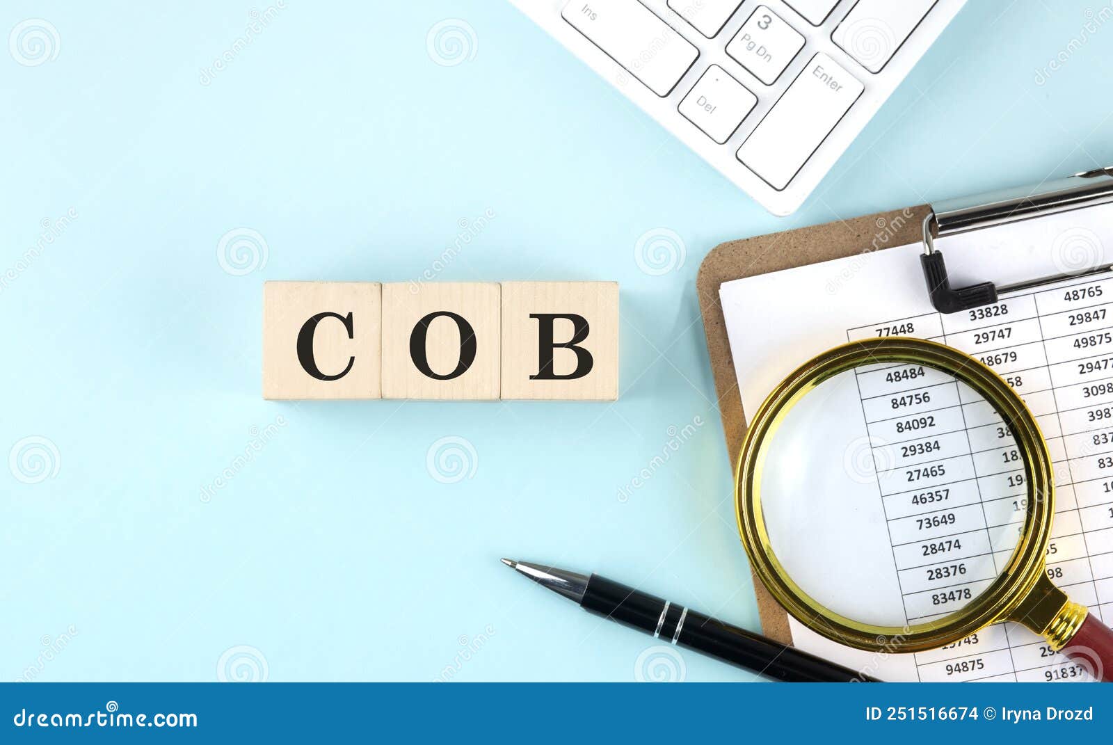 COB Word on Wooden Cubes on Blue Background with Chart and Keyboard ...