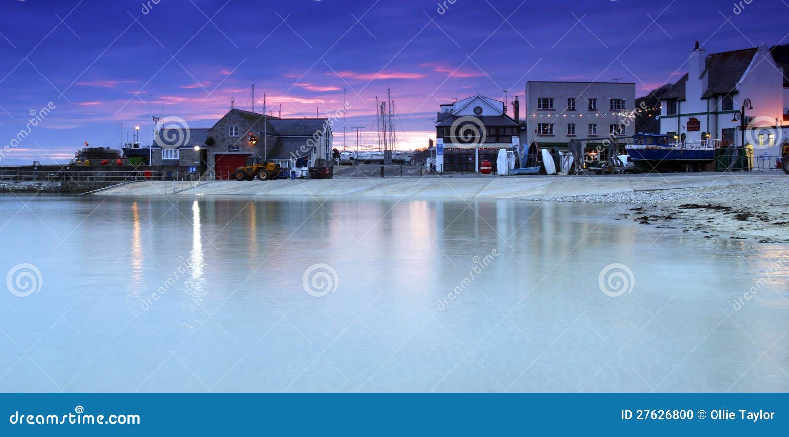 The Cobb in Lyme Regis at Sunset Stock Photo - Image of building ...