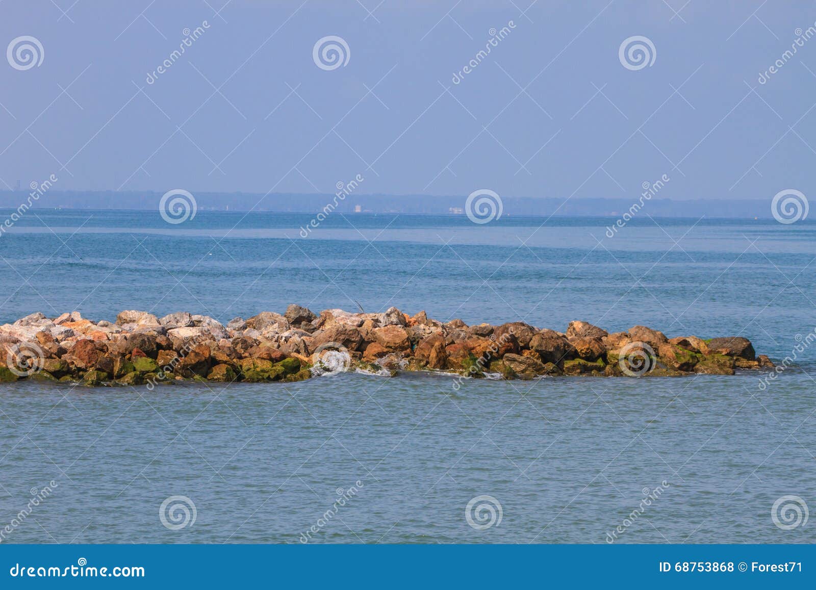 Cobble stone mole in sea stock photo. Image of architecture - 68753868