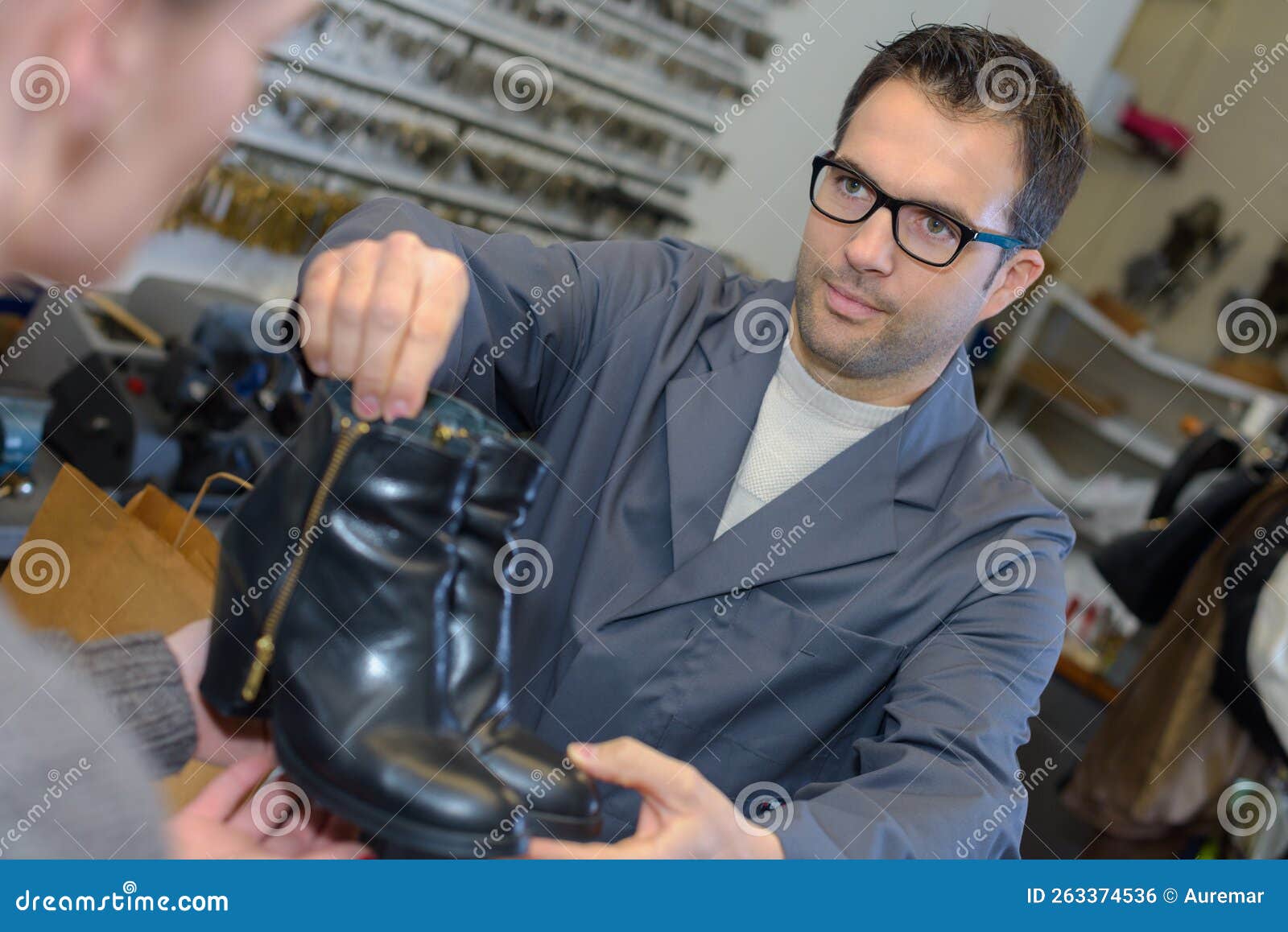 Cobbler Giving Shoes To Customer Stock Photo - Image of smile, assess ...