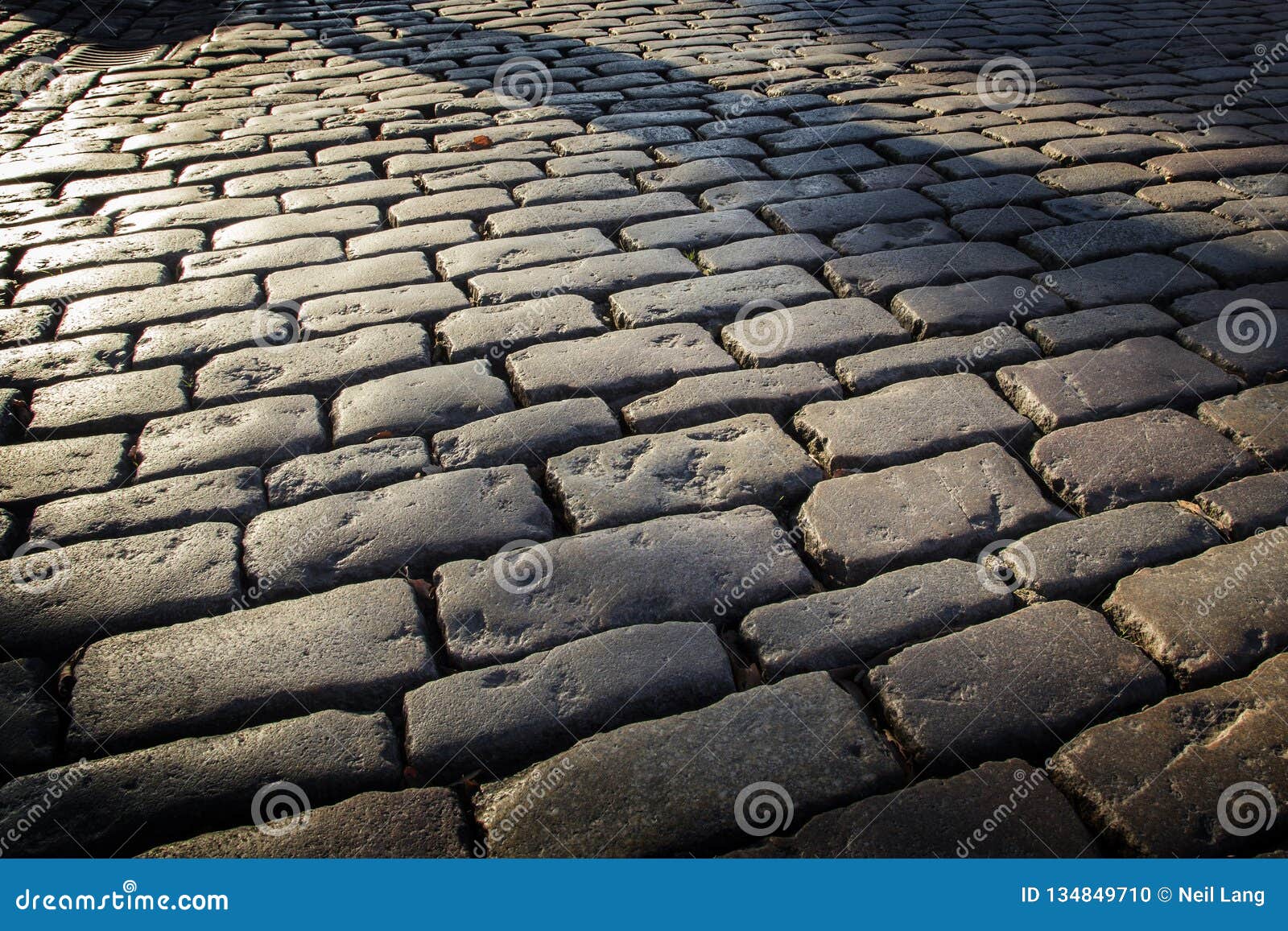 Cobblestone Background with Long Shadows at Sunset Stock Photo - Image ...