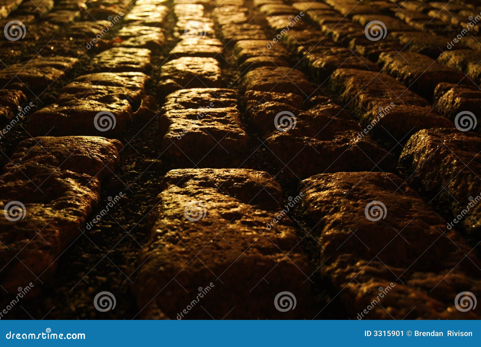 Cobblestone Path With Street Light Lamp Near Wall Of Stone Brick ...