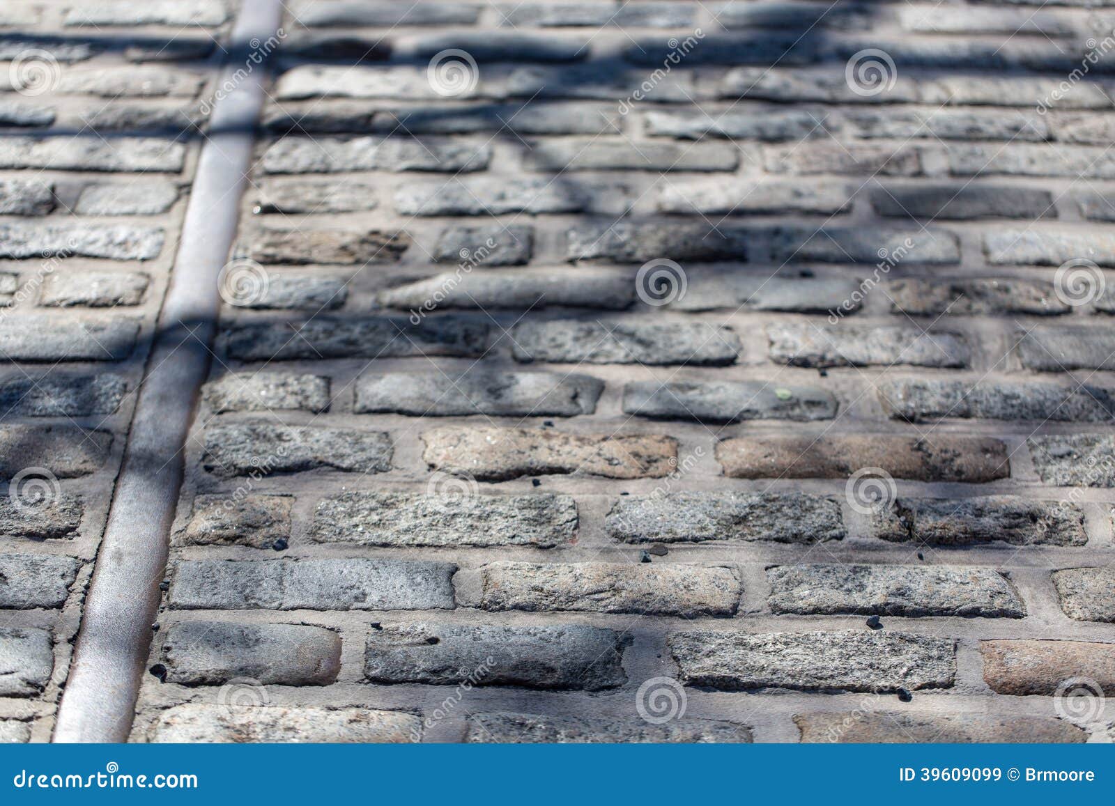 Cobblestone Path With Street Light Lamp Near Wall Of Stone Brick ...