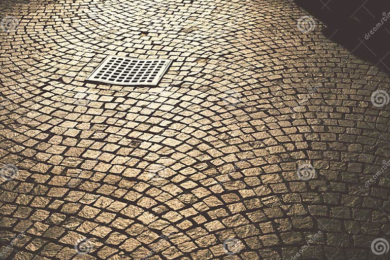 Cobblestone pavement hatch stock image. Image of drain - 86763051