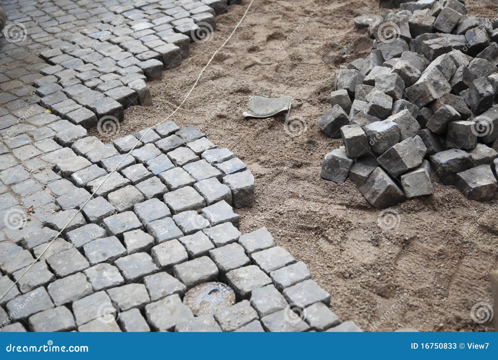 Cobblestone street repair stock image. Image of road - 16750833