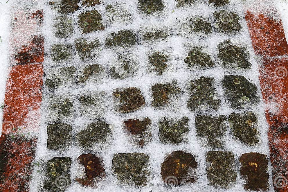 A Cobblestone Surface with Snow and Ice Stock Image - Image of sidewalk ...