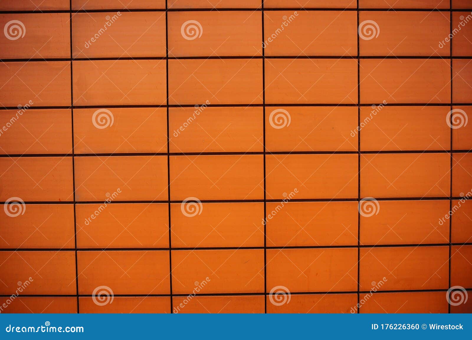 Cobblestone Wall with Rectangular Orange Tiles Stock Photo - Image of ...