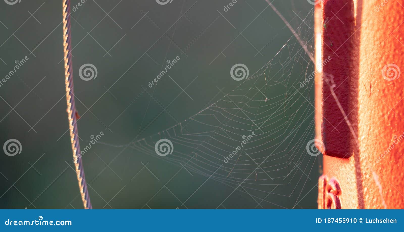 Cobweb on red metal pillar stock photo. Image of metal - 187455910