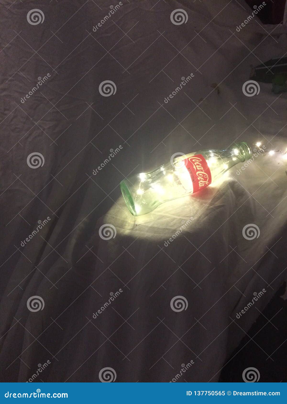 Coca-Cola bottle spilling editorial image. Image of lights - 137750565