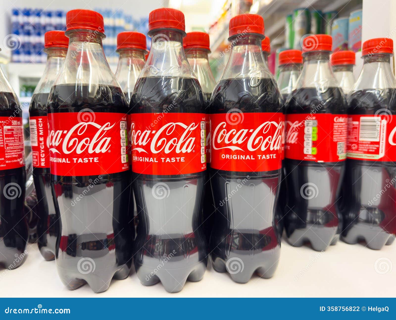 Coca-cola Bottles on Store Shelf Displaying Original Taste Label ...