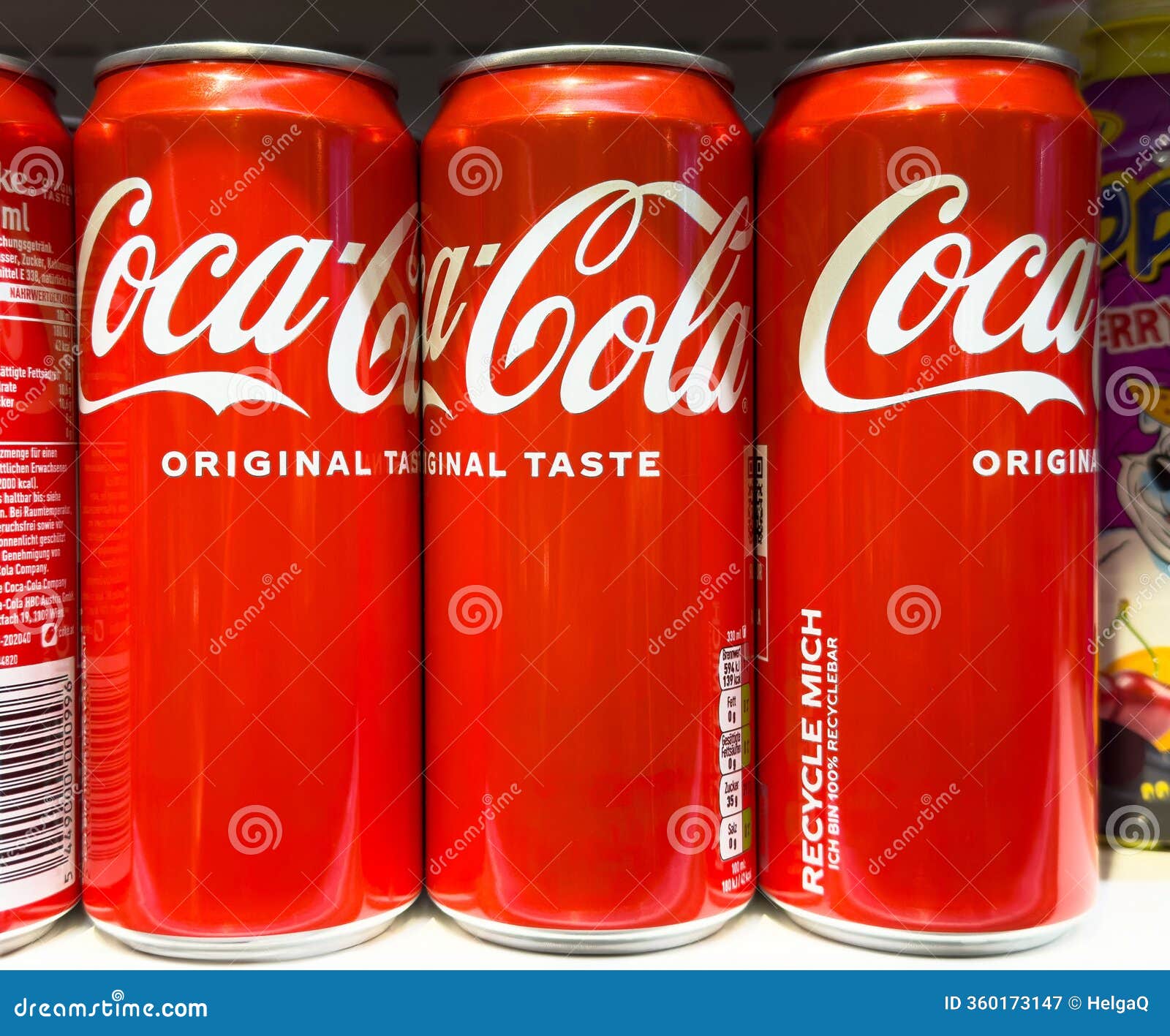 Coca-cola Cans Displayed on Store Shelf with Vibrant Red Packaging and ...