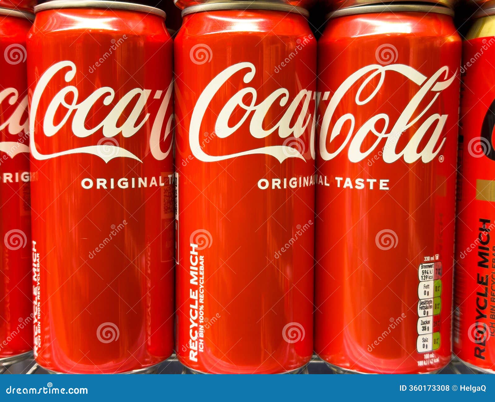 Coca-cola Original Taste Cans in a Row Displaying Logo and Branding ...