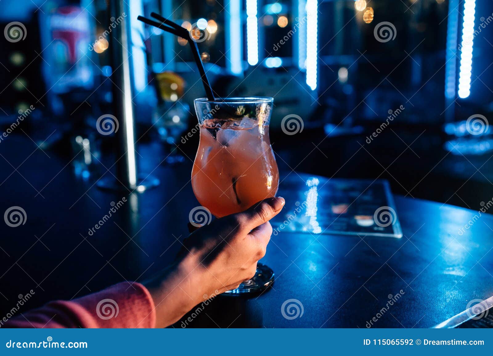 Cocktail in hand stock photo. Image of holiday, girl - 115065592