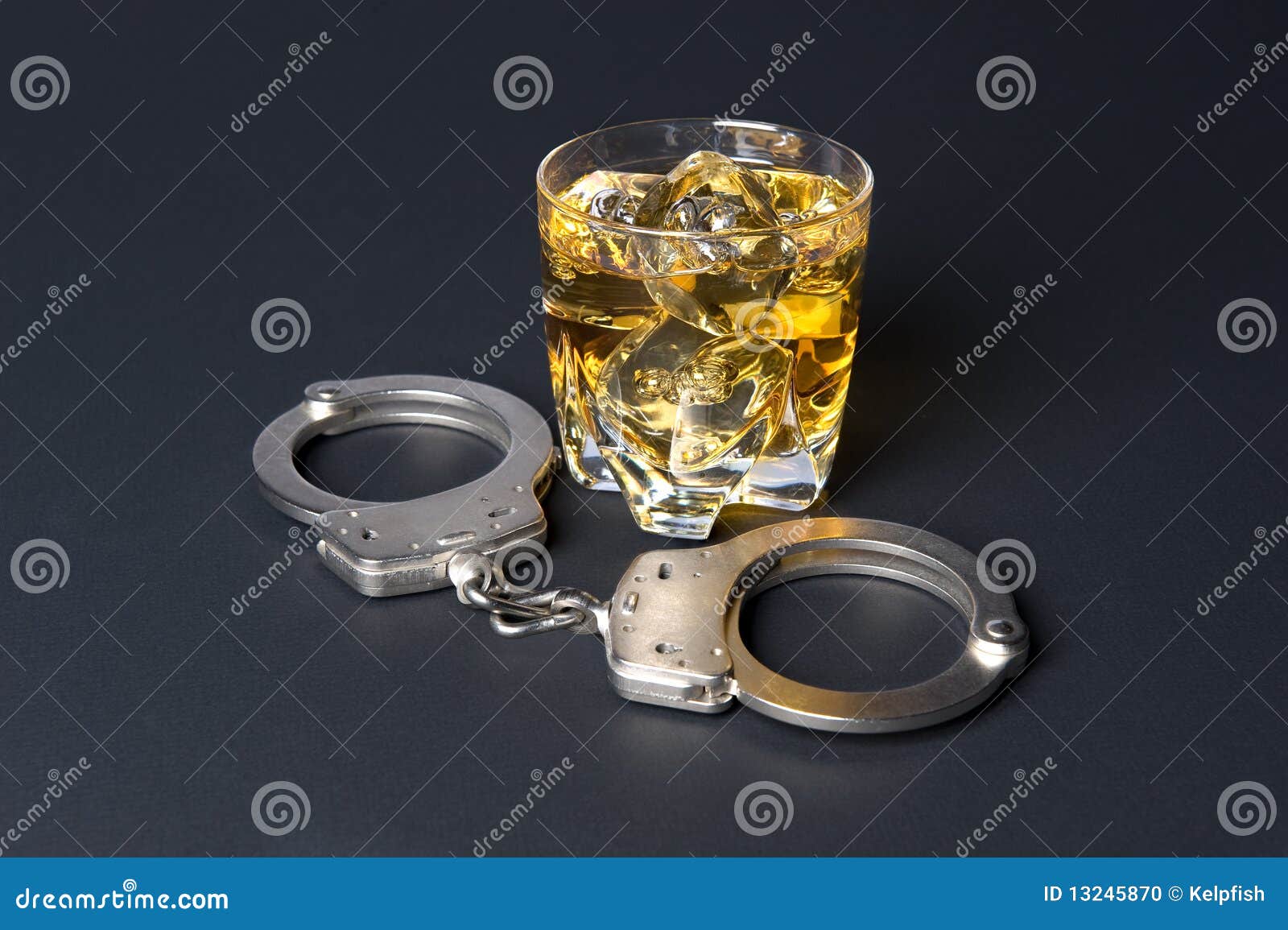 Cocktail and handcuffs stock photo. Image of studio, drink - 13245870