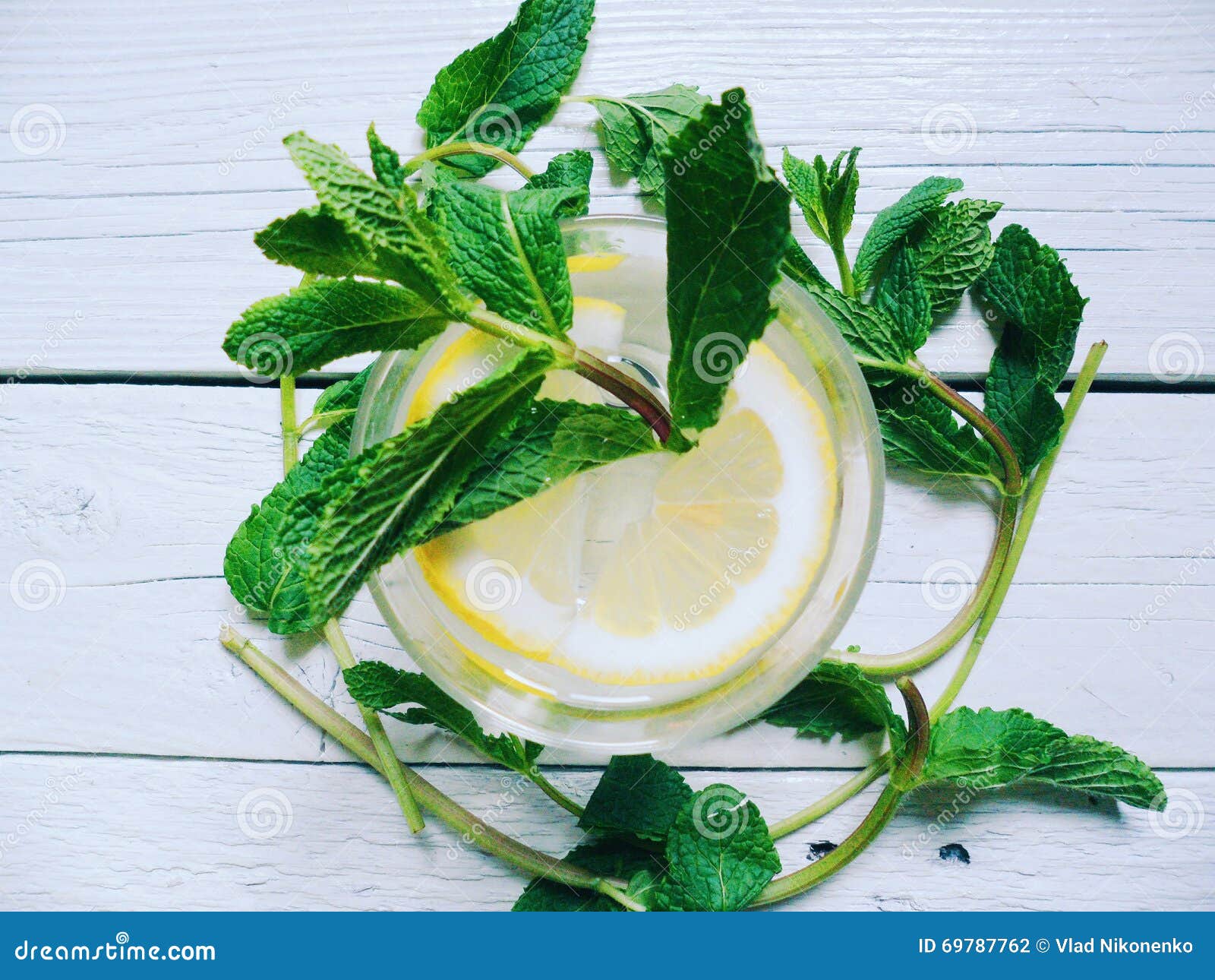 Cocktail with Lemon and Mint Leaves on a White Background Stock Photo ...
