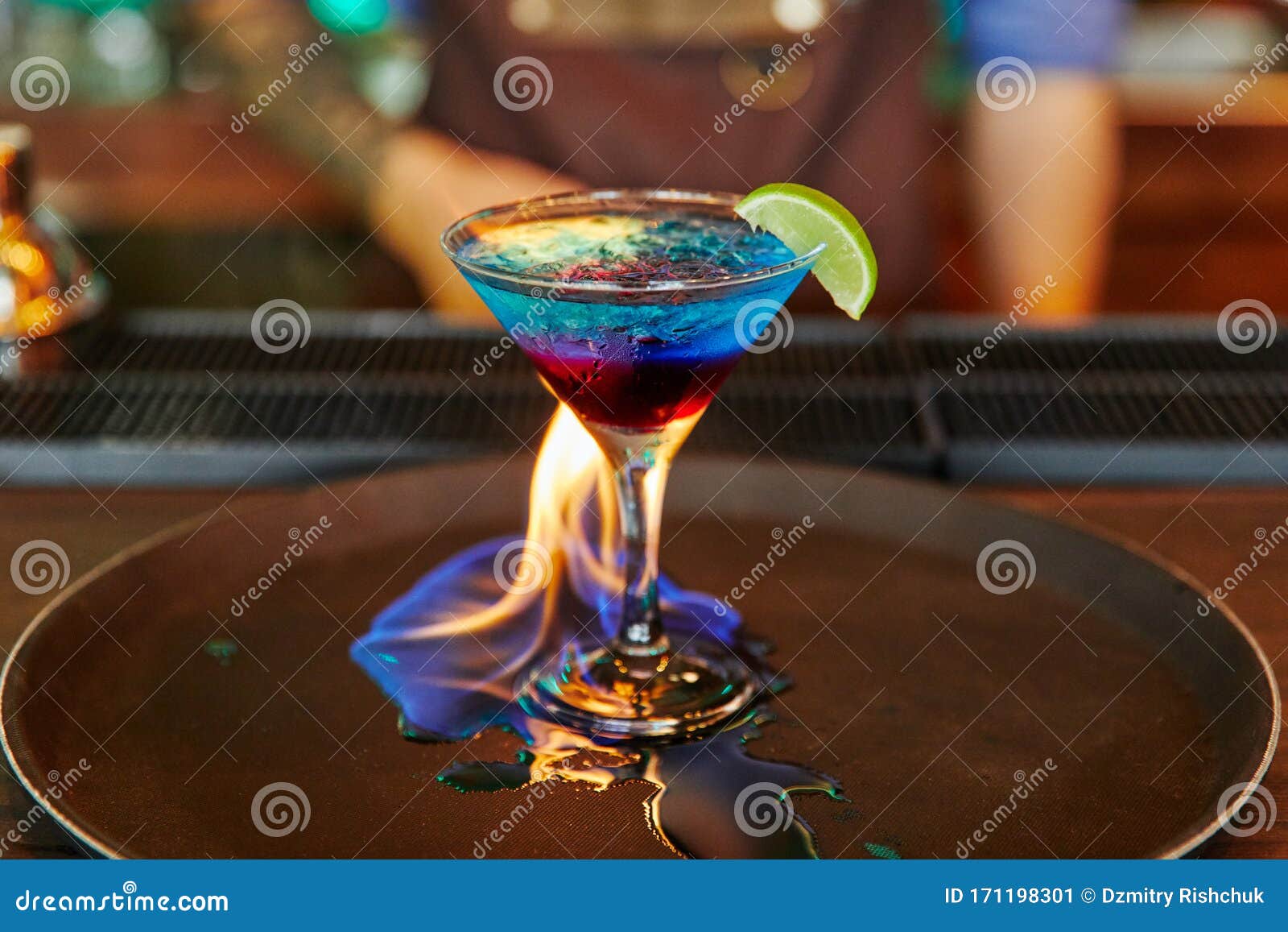 Cocktail with Lime Burning Fire in a Glass Goblet, Alcohol Stock Image ...