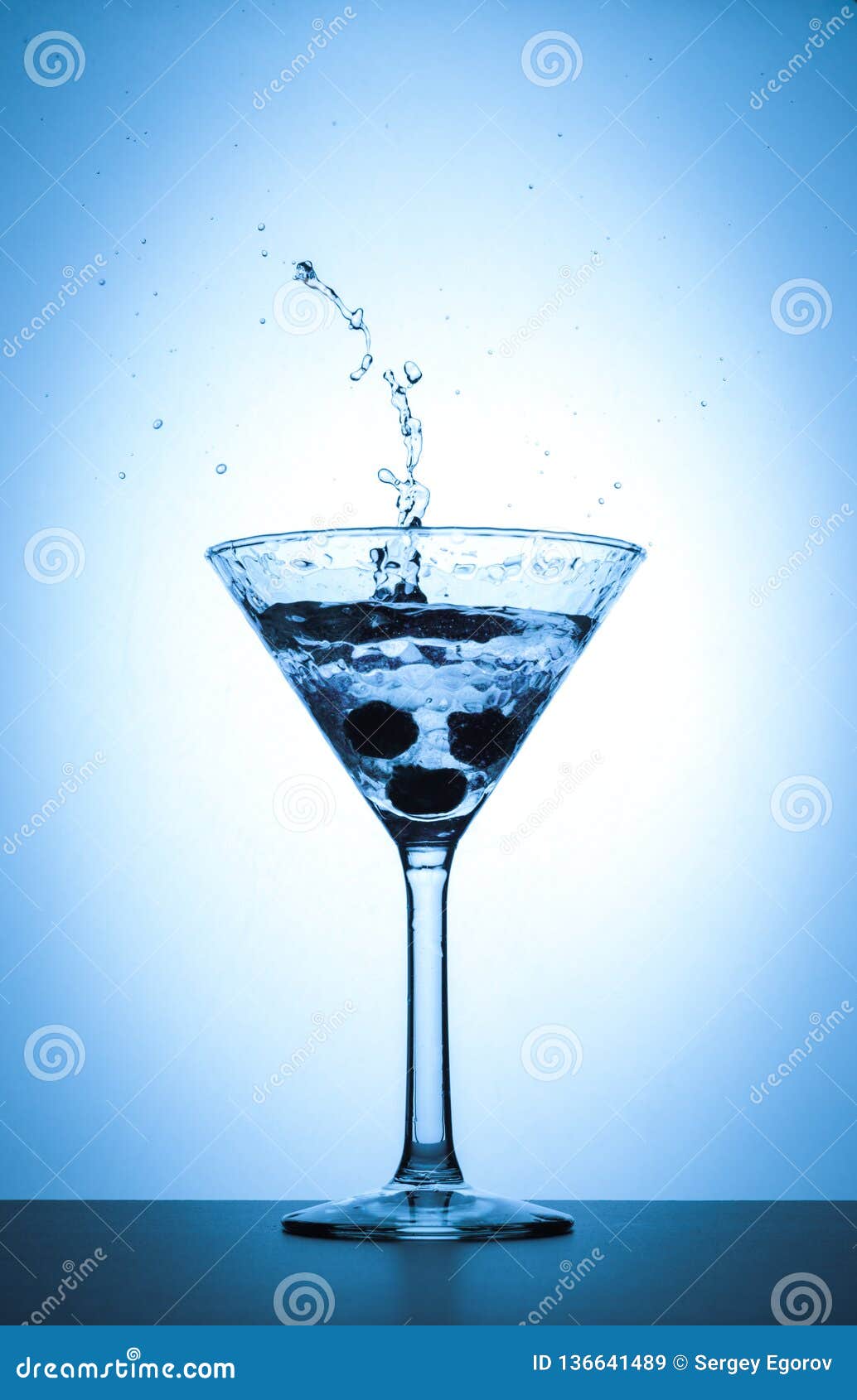 Cocktail Martini Glass Splash on White and Blue Gradient Background ...