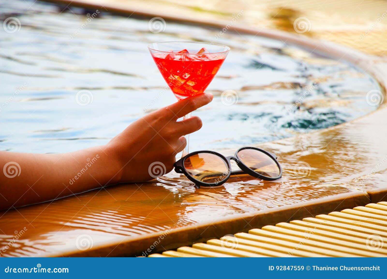Cocktail by the poolside stock image. Image of summer - 92847559