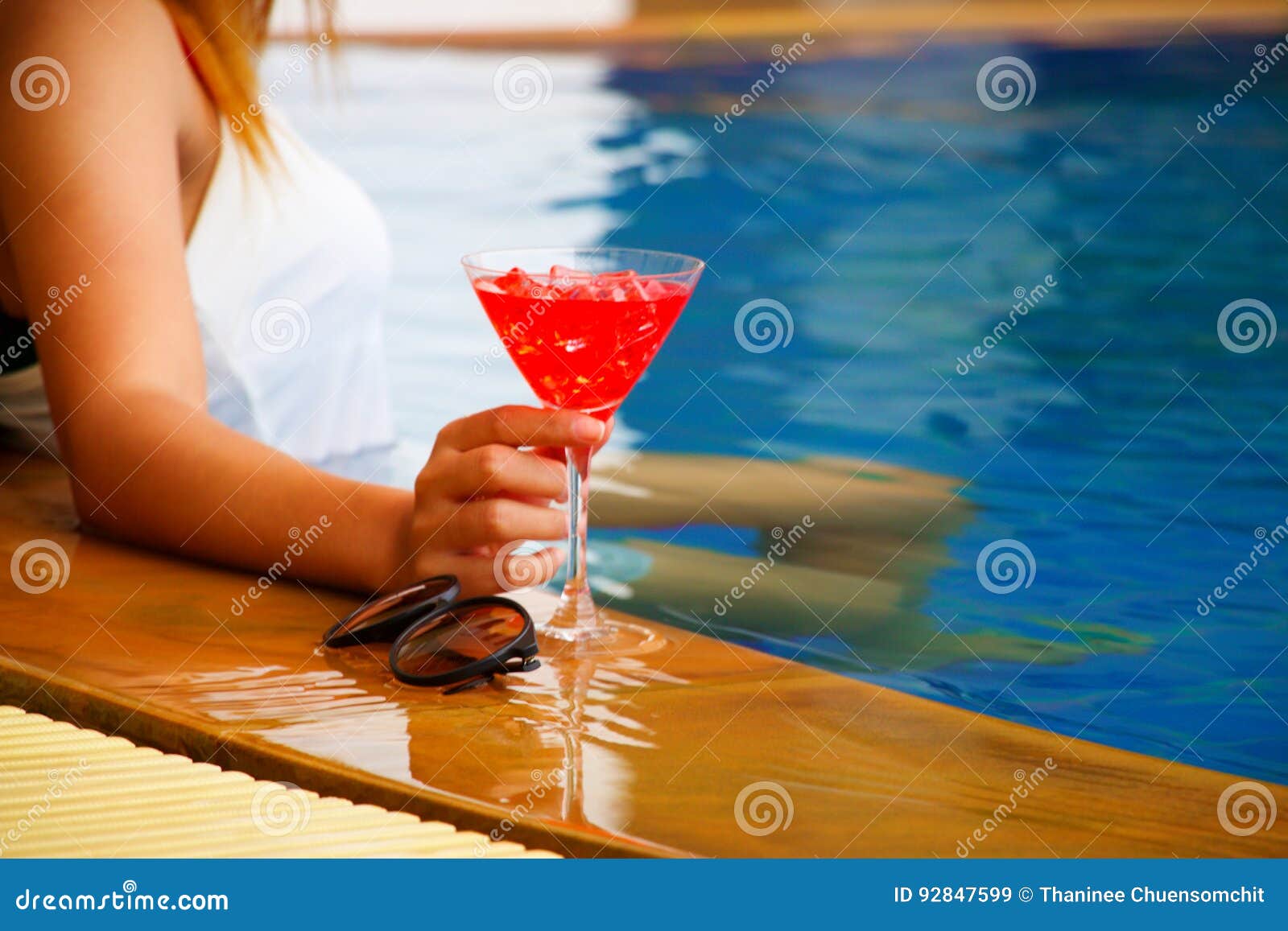 Cocktail by the poolside stock image. Image of summer - 92847599