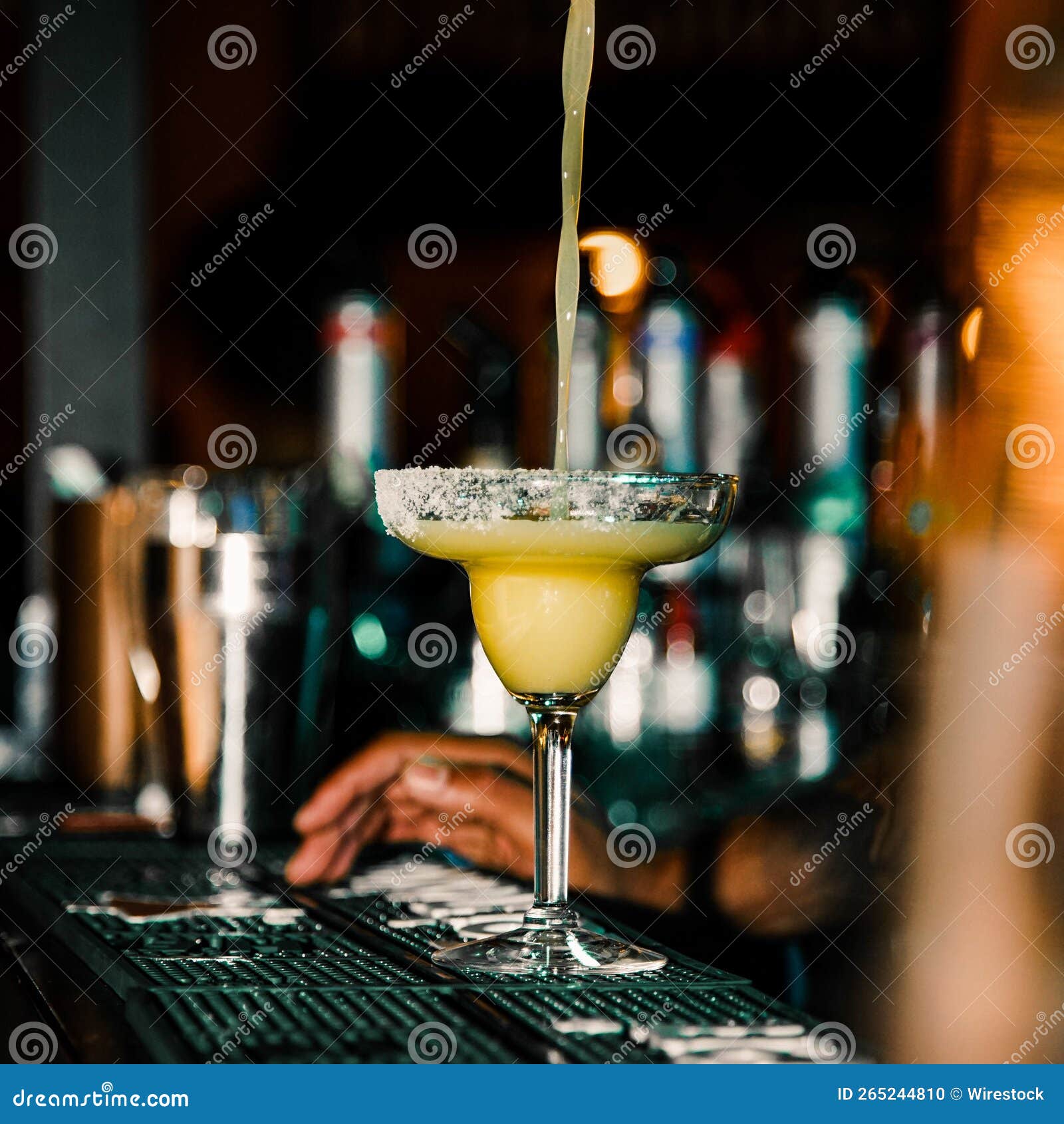 Cocktail on a Table of a Bar with a Liquid Being Poured into it Stock ...