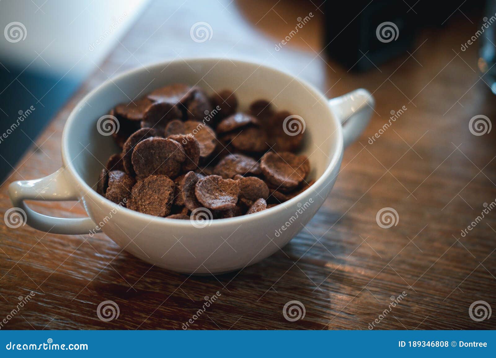 Coco crunch in white bowl stock photo. Image of group - 189346808