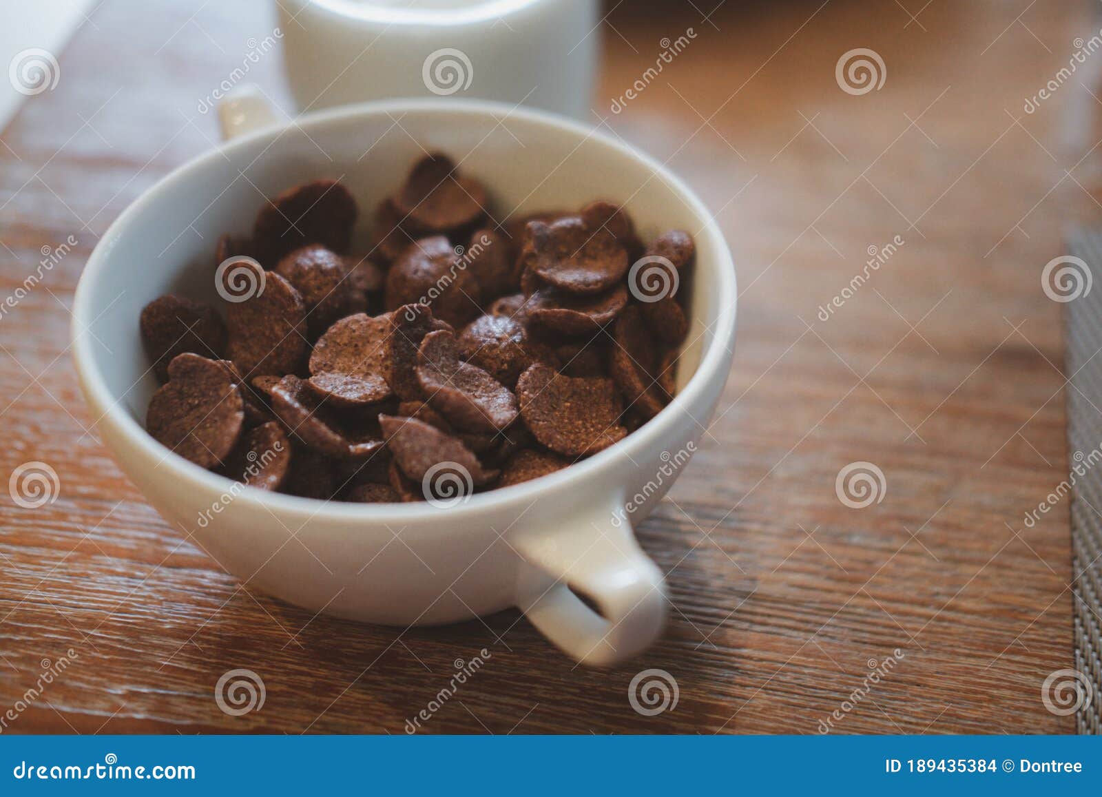 Coco crunch in white bowl stock photo. Image of flake - 189435384