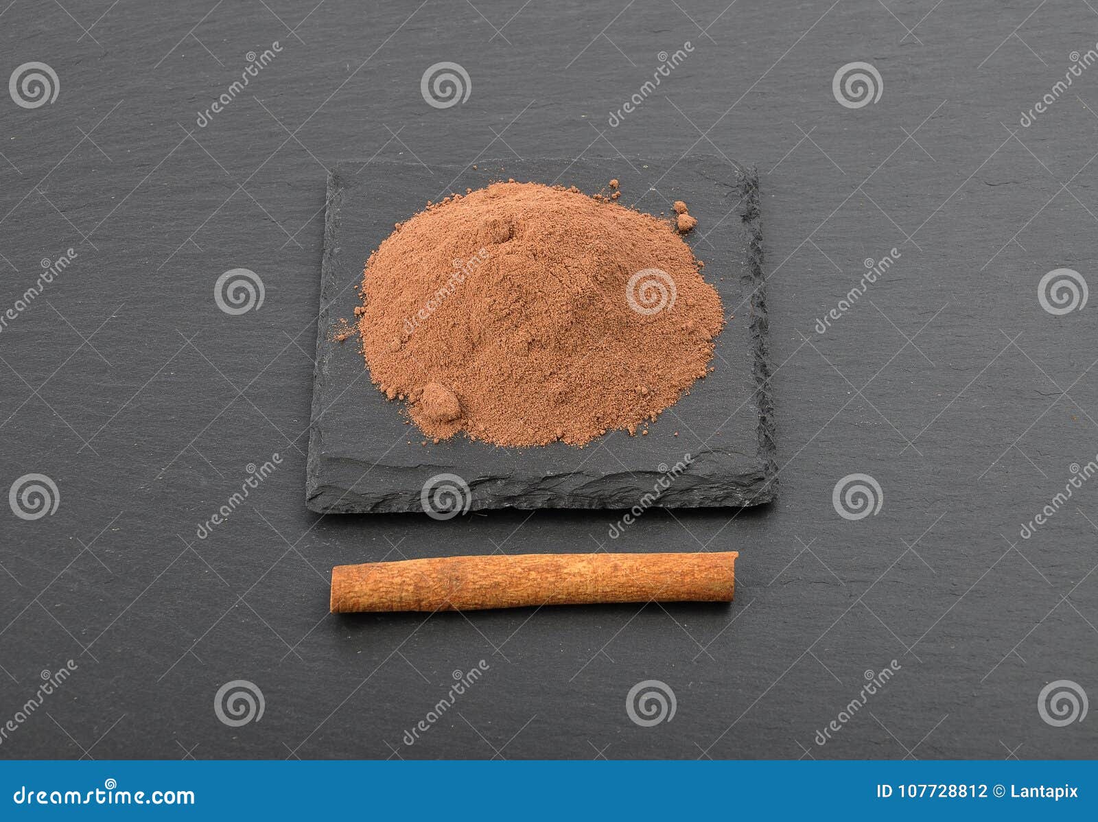 Cocoa Powder and Cinnamon Stick on Shale Stock Photo - Image of ...