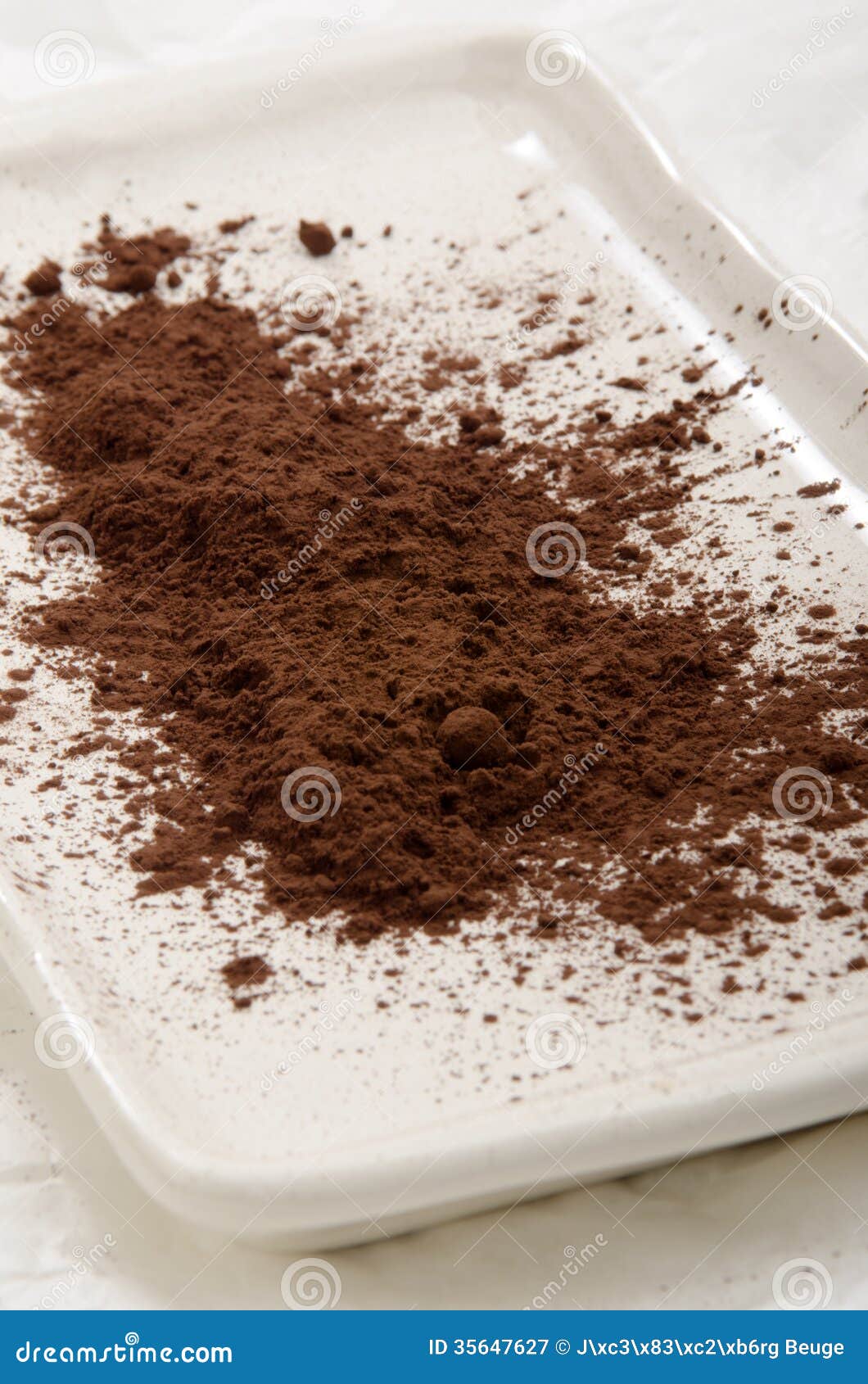 Cocoa Powder on a White Plate Stock Image - Image of pile, food: 35647627