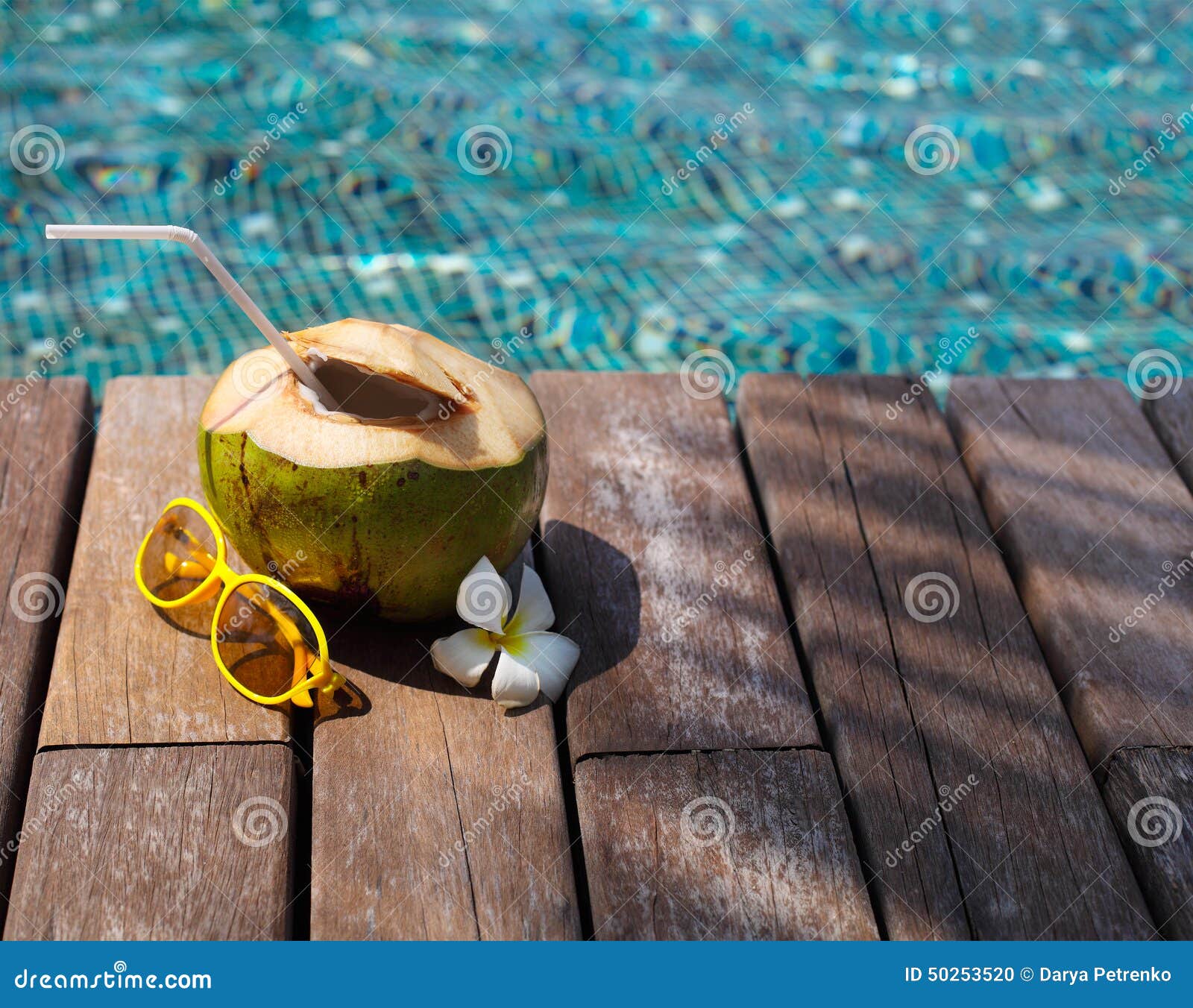 Coconut Cocktail with Drinking Straw by the Swimming Pool Stock Photo ...