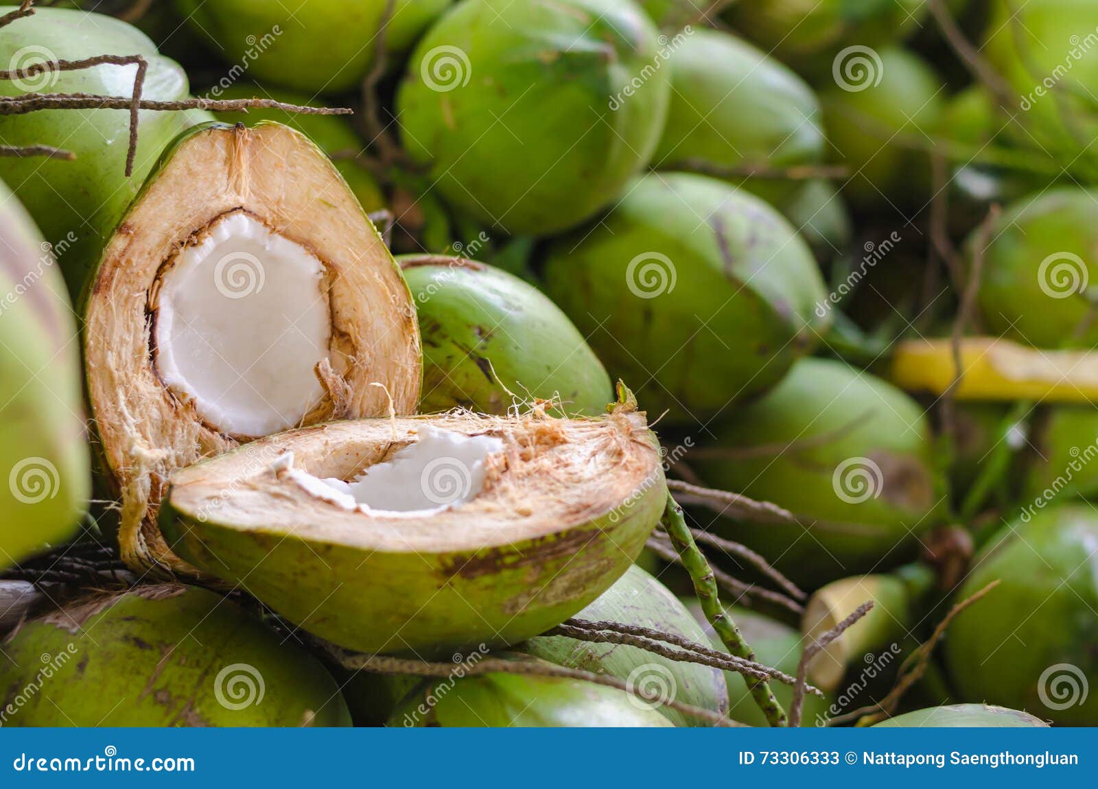 Coconut Divided in Half on a Heap of Coconuts. Selective Focus Stock ...