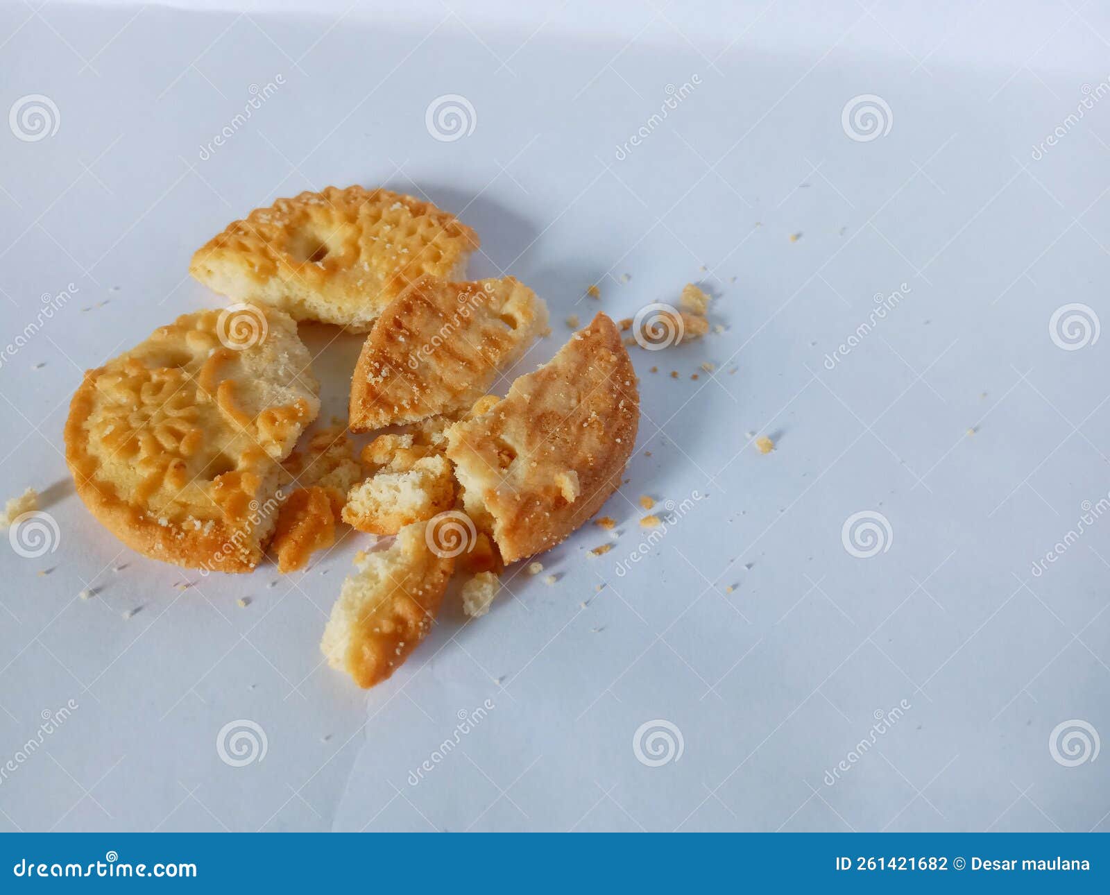 Coconut Flavored Biscuits Broken into Pieces on a White Background ...