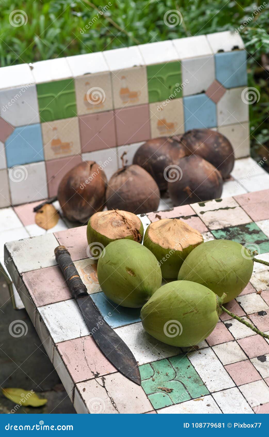 Coconut and knife on table stock image. Image of fresh - 108779681