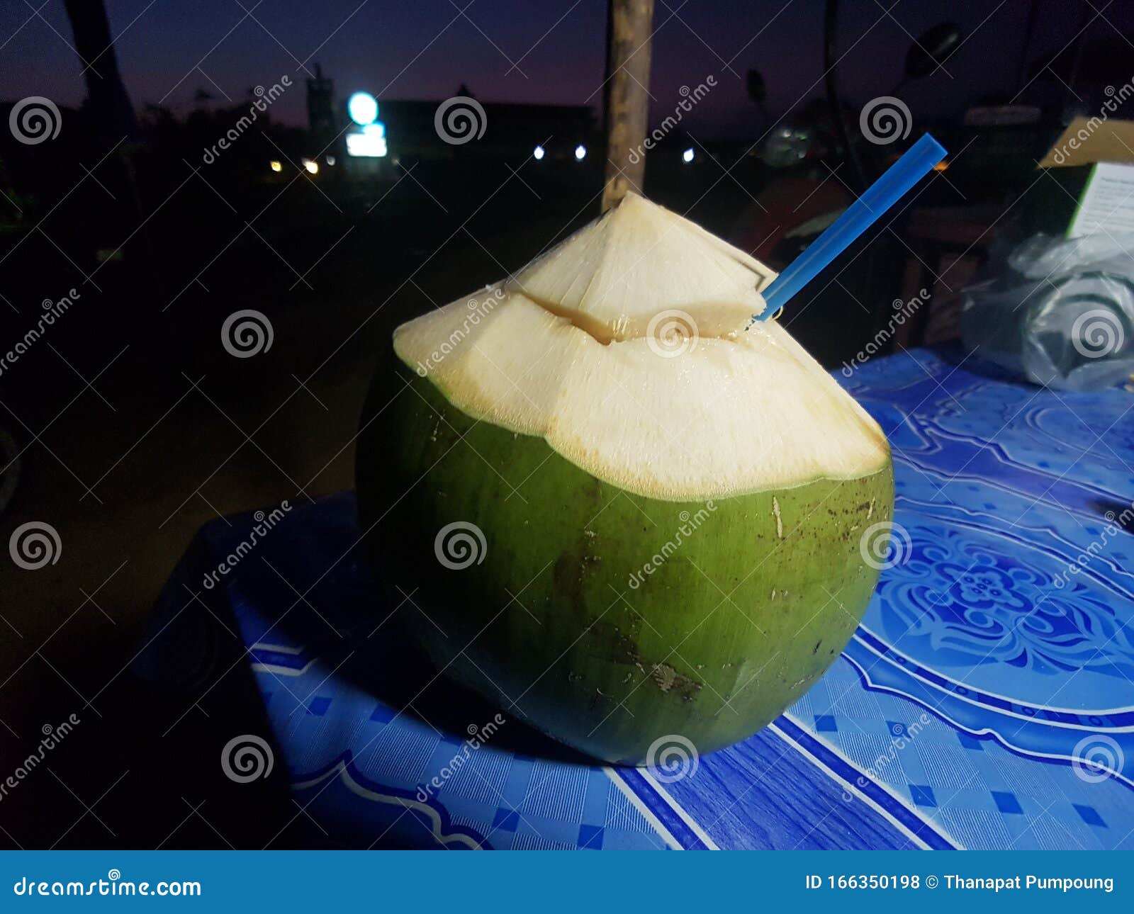 Coconut Shell with Blue Straw Stock Photo - Image of drink, eating ...