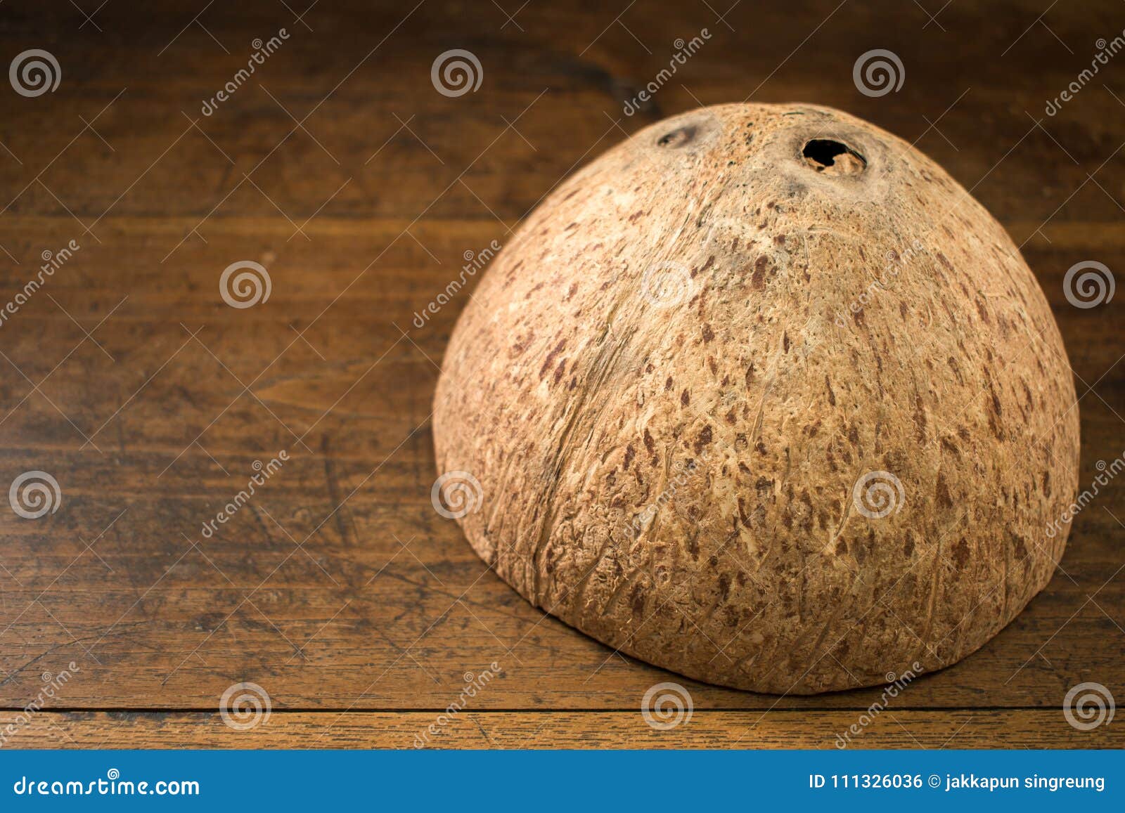 Coconut Shell Upside Down on a Wooden Background Closeup Stock Photo ...