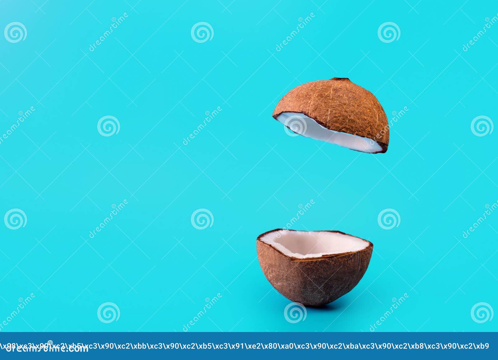 Coconut Split in Half and Flying on Isolated Turquoise Background ...
