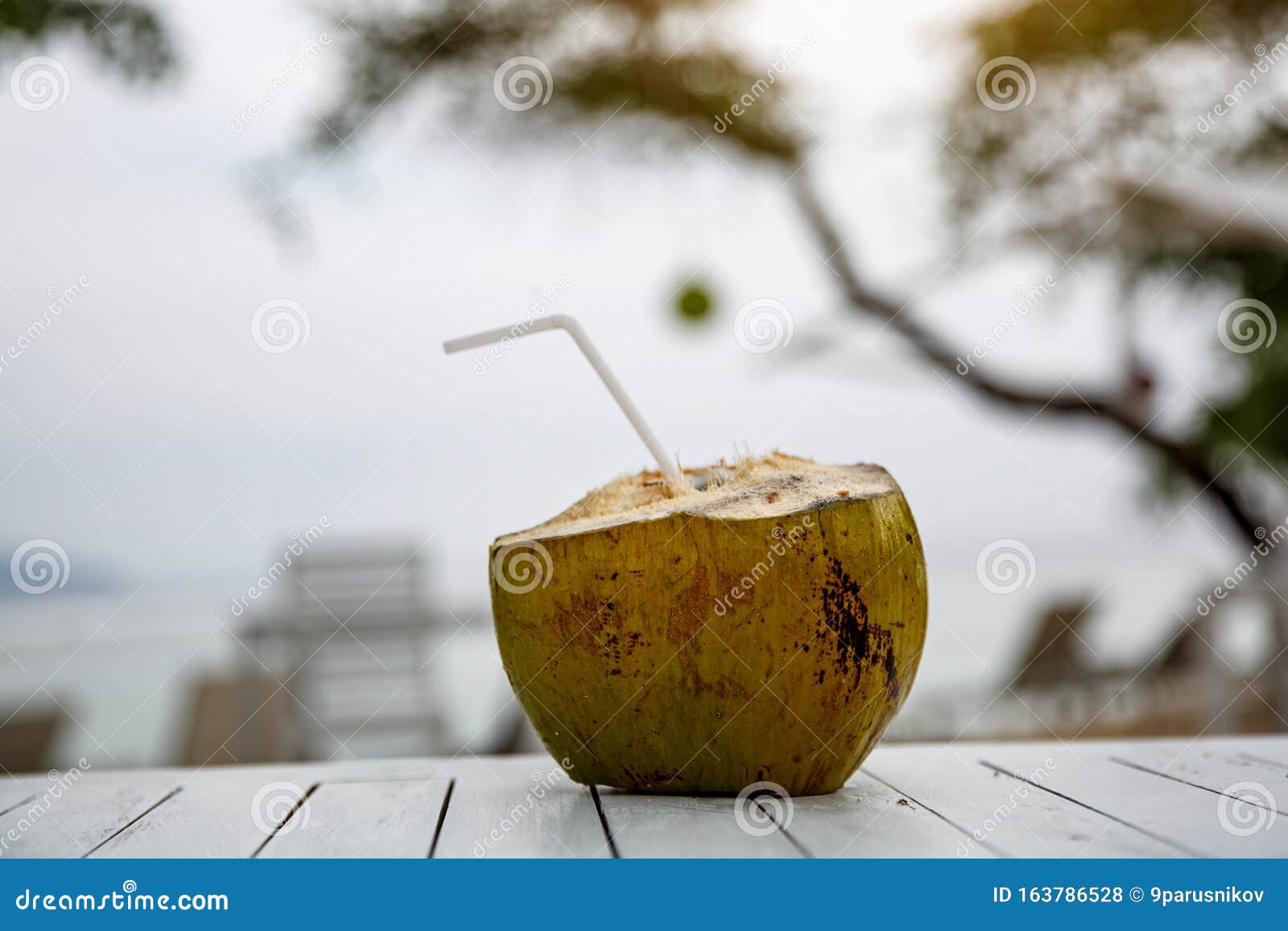 Coconut with a Tube on a White Table Stock Photo - Image of mango ...