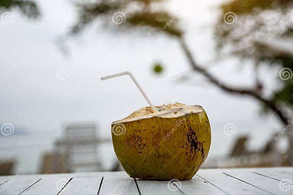 Coconut with a Tube on a White Table Stock Photo - Image of mango ...