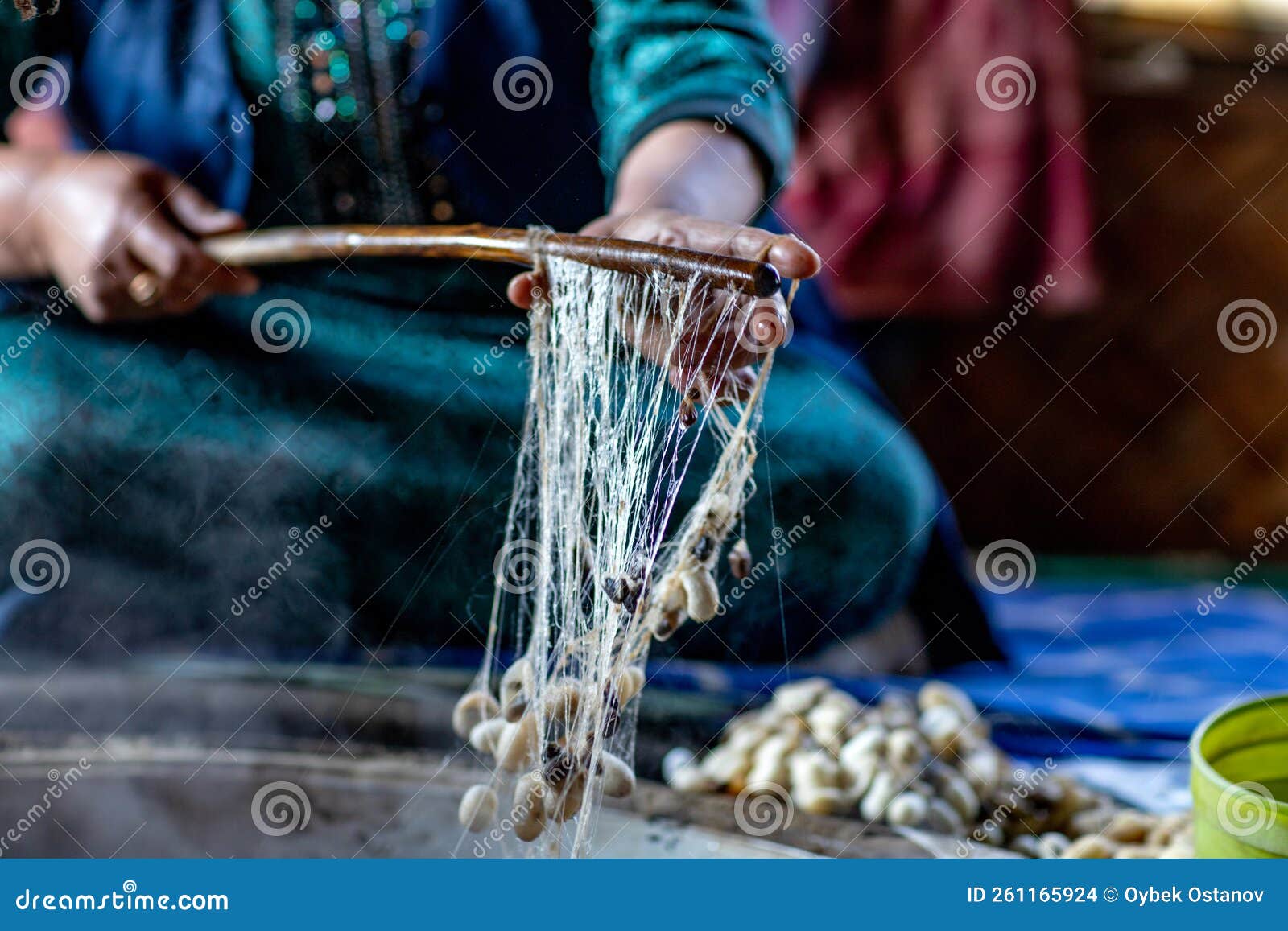 The Cocoons are Boiled in the Cauldron To Spin the Fiber into the Spool ...