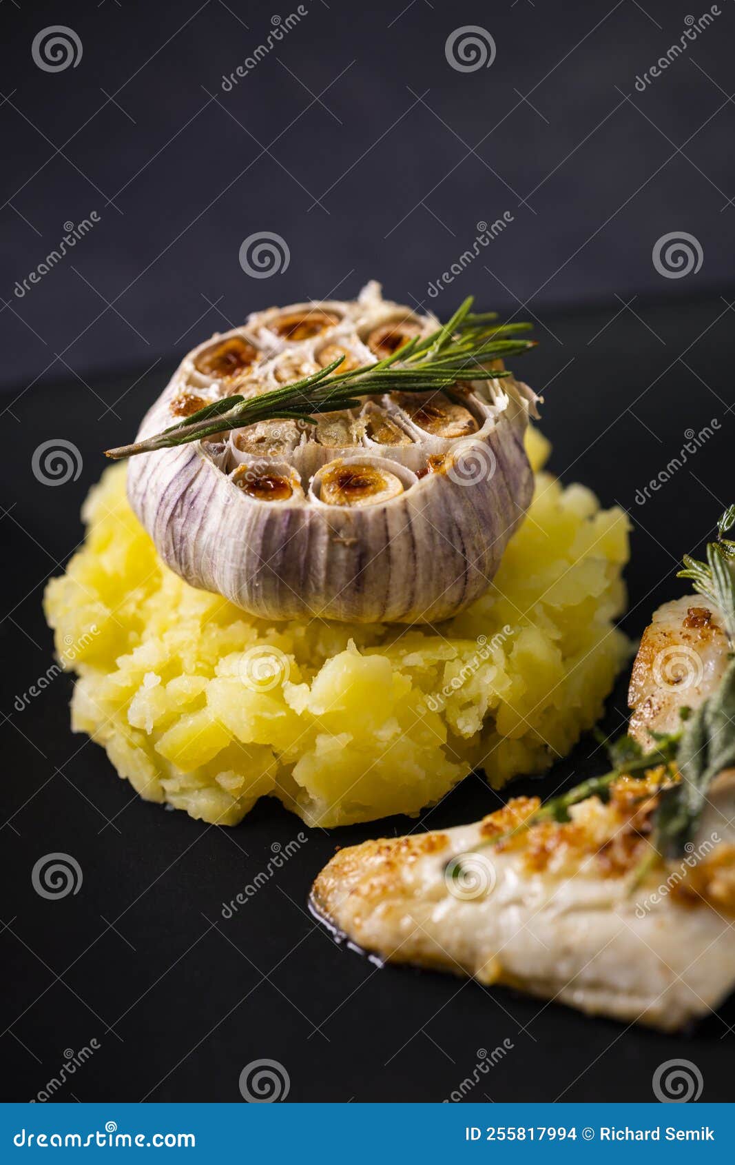 Cod Fillet with Couscous and Roasted Garlic Stock Photo - Image of ...