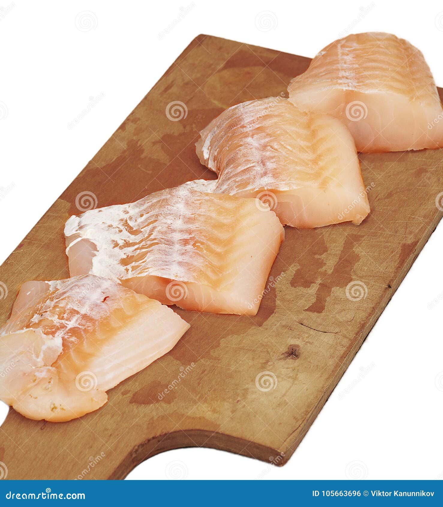 Cod Fillet in Pieces on the Cutting Board Stock Photo - Image of dinner ...